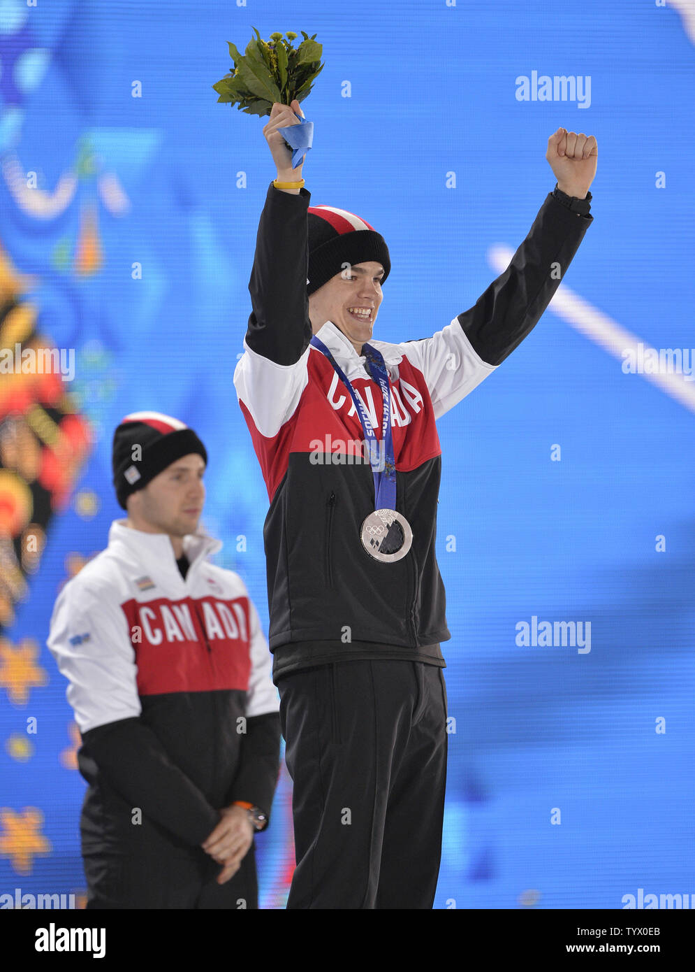 Canada's Mikael Kingsbury celebrates after receiving a silver medal ...