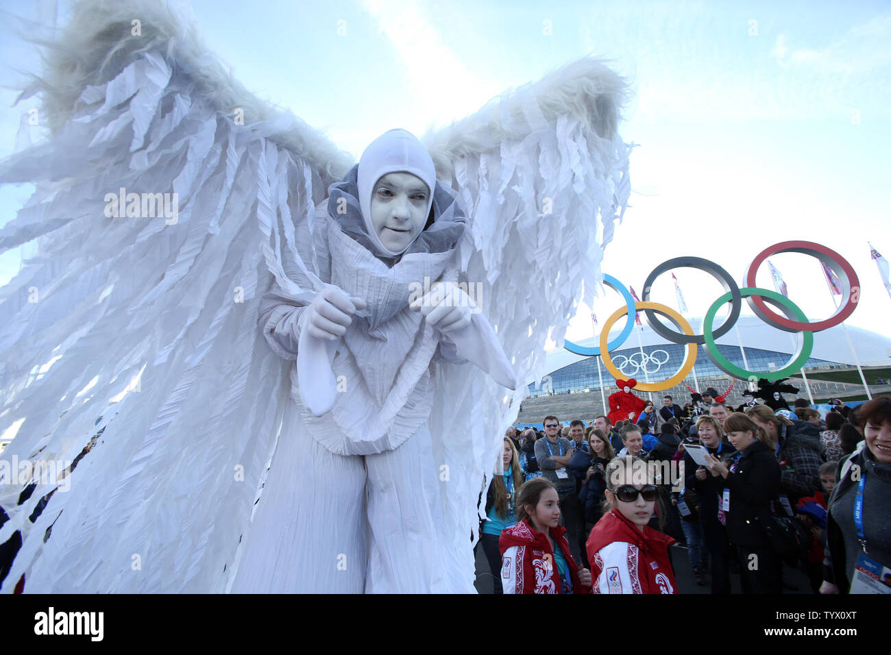 A person disguised as a white angel entertains visitors at the Olympic ...