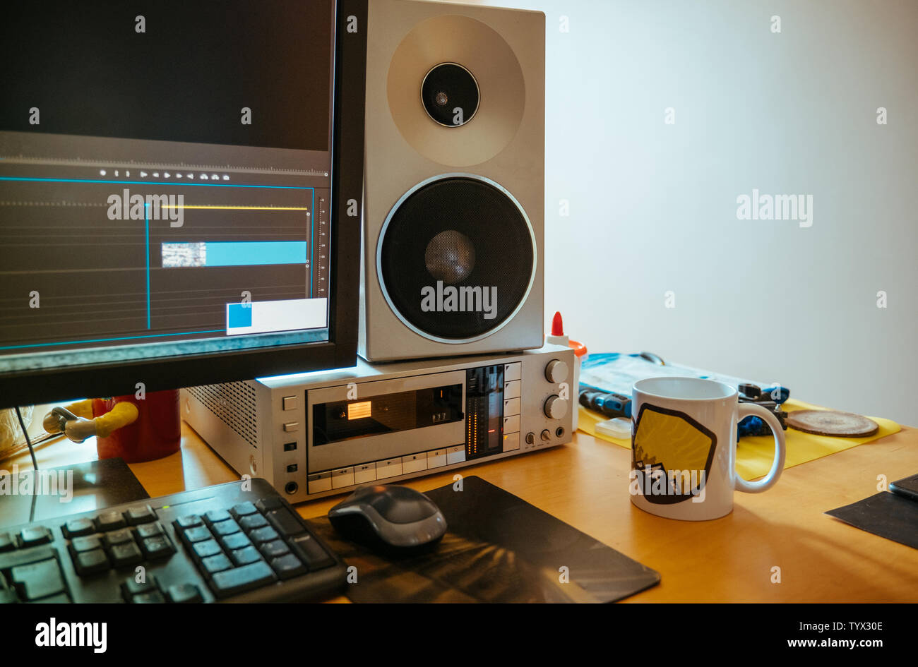 Table with music system keyboard monitor and cover Stock Photo - Alamy