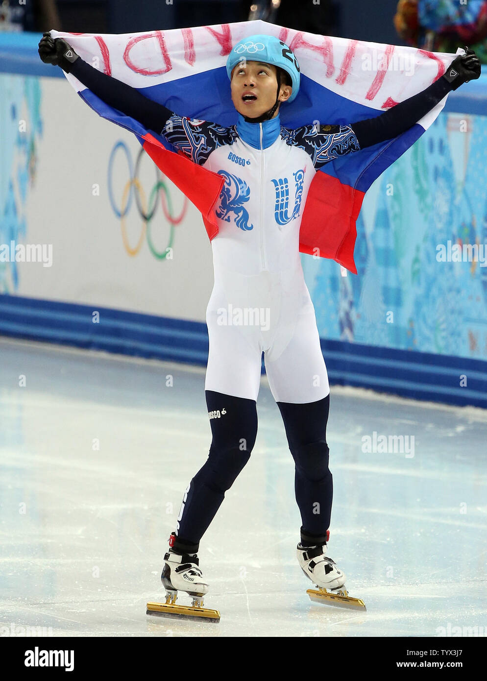 Russia's Victor An holds his country's flag as he celebrates his gold ...