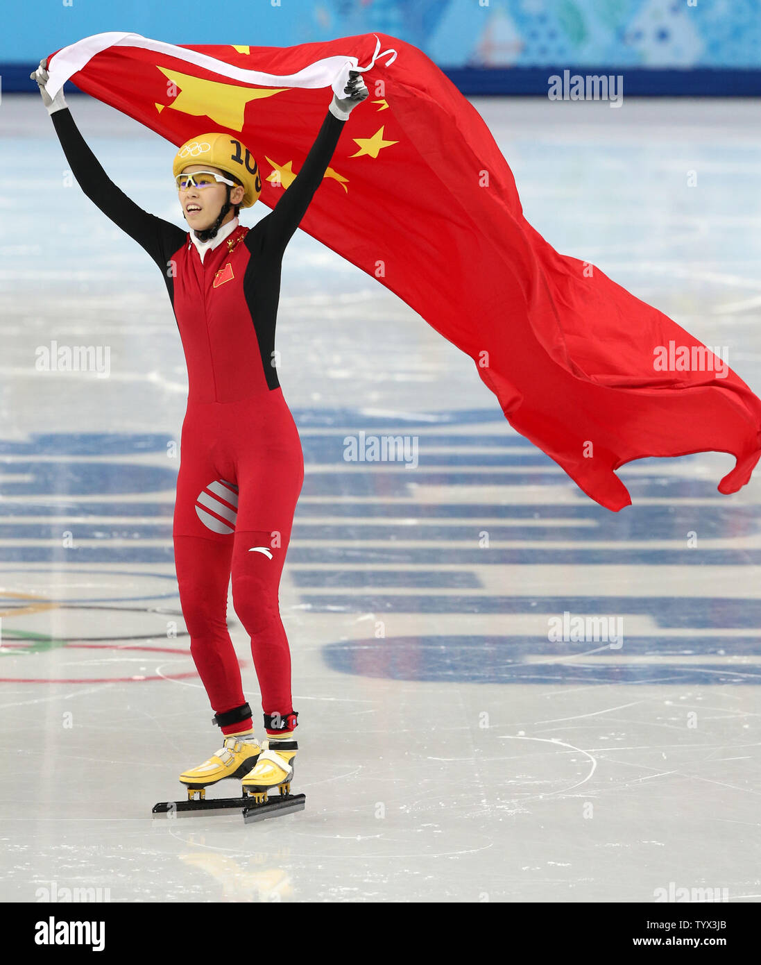 China's Fan Kexin holds her country's flag as she celebrates her silver ...