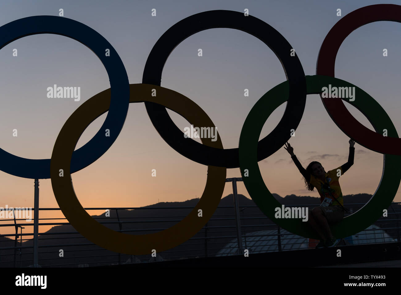 The sunsets over the Olympic Rings at the Rio Olympic Park in Rio de ...