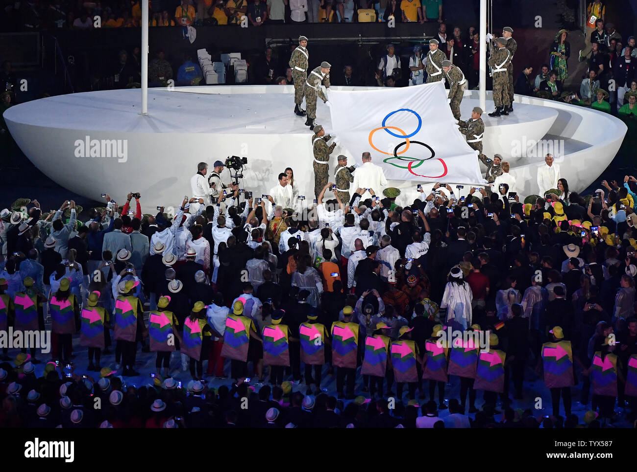 The Olympic flag enters the arena at the Opening Ceremony of the 2016 ...