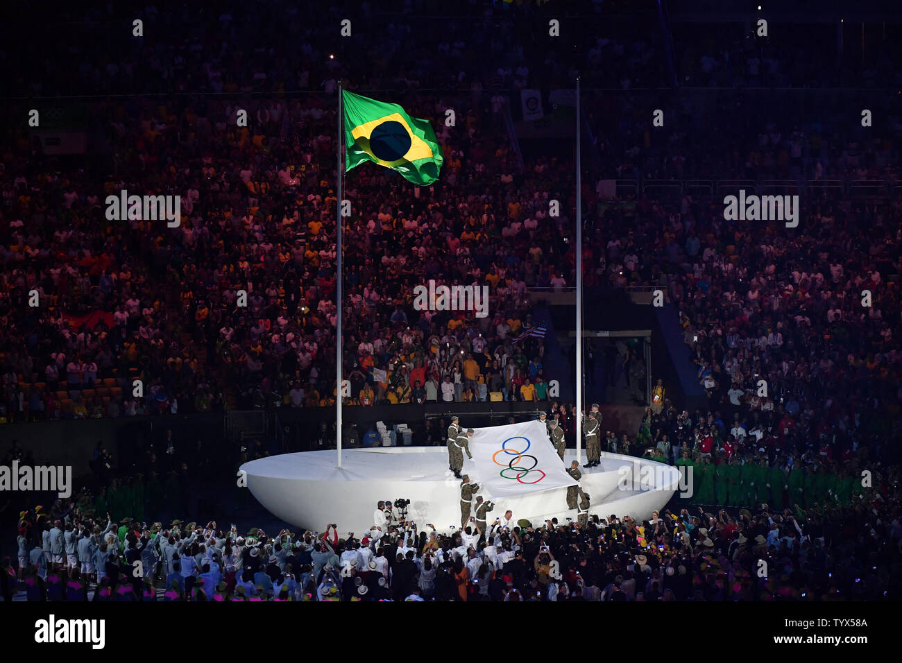 The Olympic flag enters the arena at the Opening Ceremony of the 2016 ...