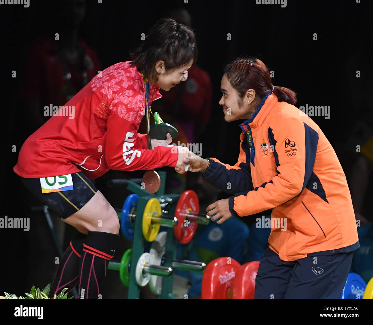 Thailand's Tanasan Sopita (R) greets Japan's Hiromi Miyake during the ...
