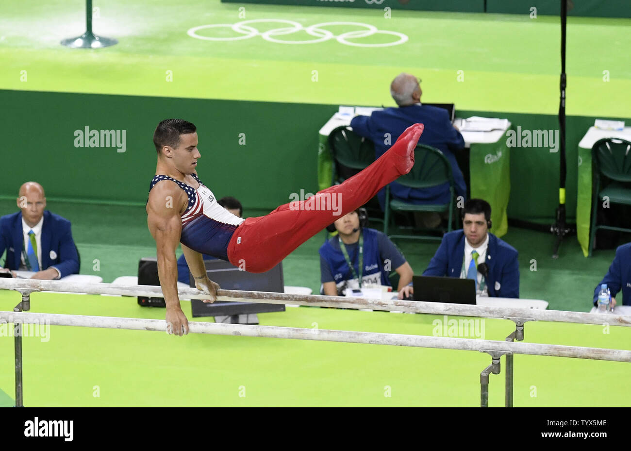 American Jacob Dalton is watched by judges as he competes in the ...