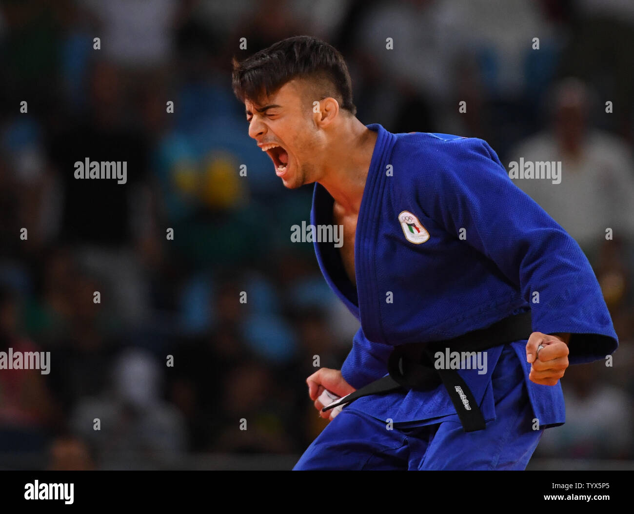 Italy's Fabio Basile reacts upsetting Baul An of South Korea in the of ...