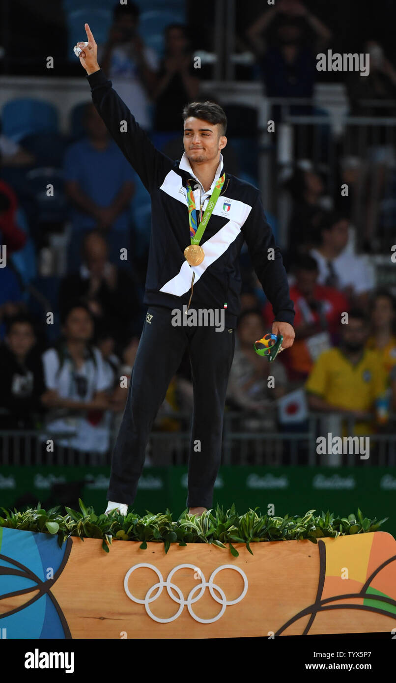 Italy's Fabio Basile stands atop the podium after winning the gold ...