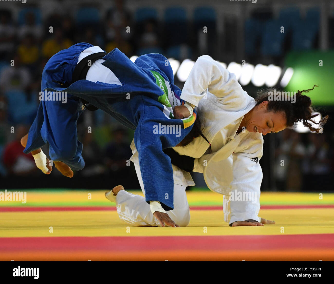 Andrea Chitu of Romania (R) wrestles with Brazil's Erika Miranda in ...