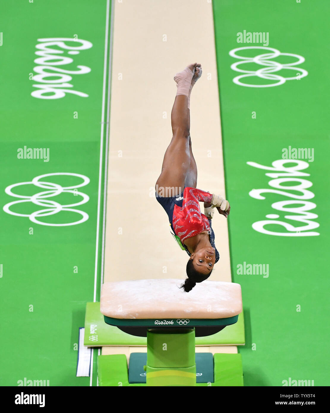 American gymnast Gabby Douglas competes in the vault qualifications at ...
