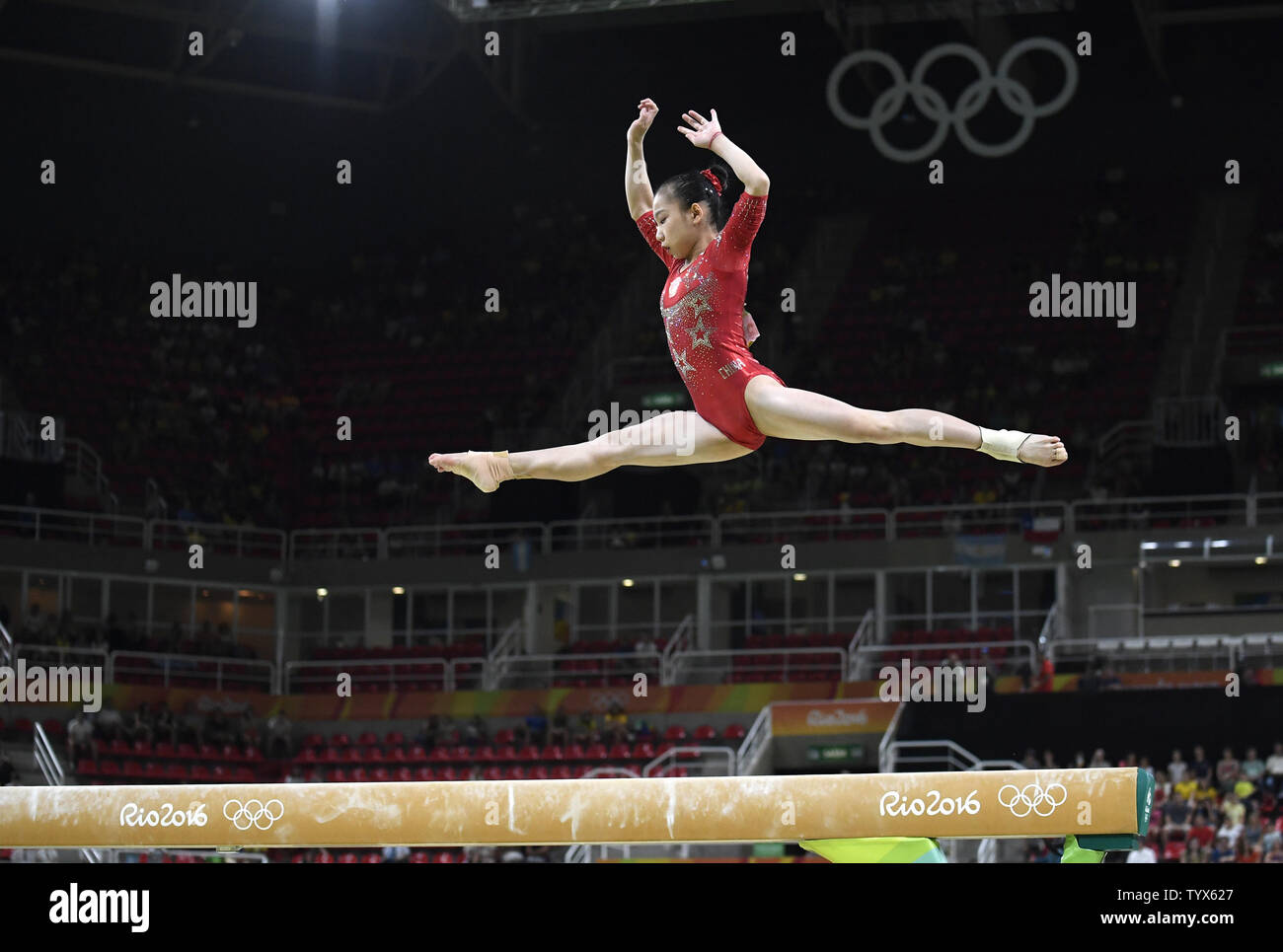 Chinese gymnast Wang Yan is airborne as she competes in the Women's ...