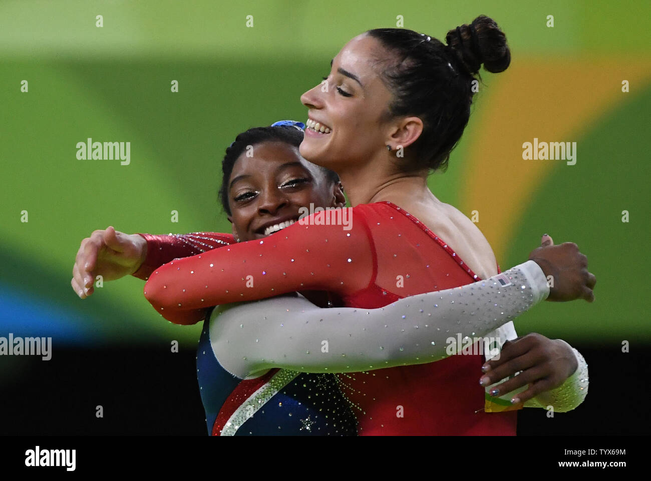 Aly Raisman and Simone Biles of the United States embrace after ...