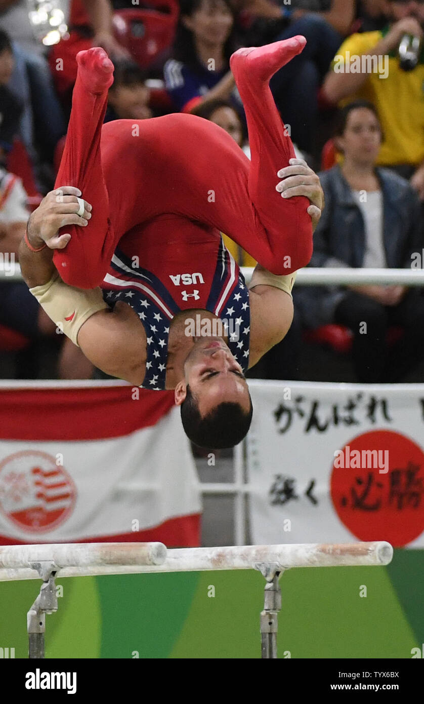 American Danell Leyva does a somersault on the parallel bars in ...