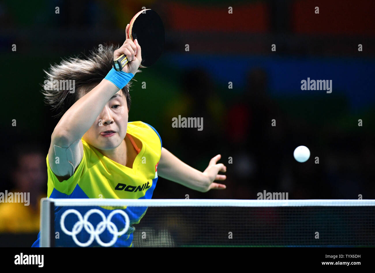Singapore's Feng Tianwei returns the ball to Australia's Liu Jia during ...
