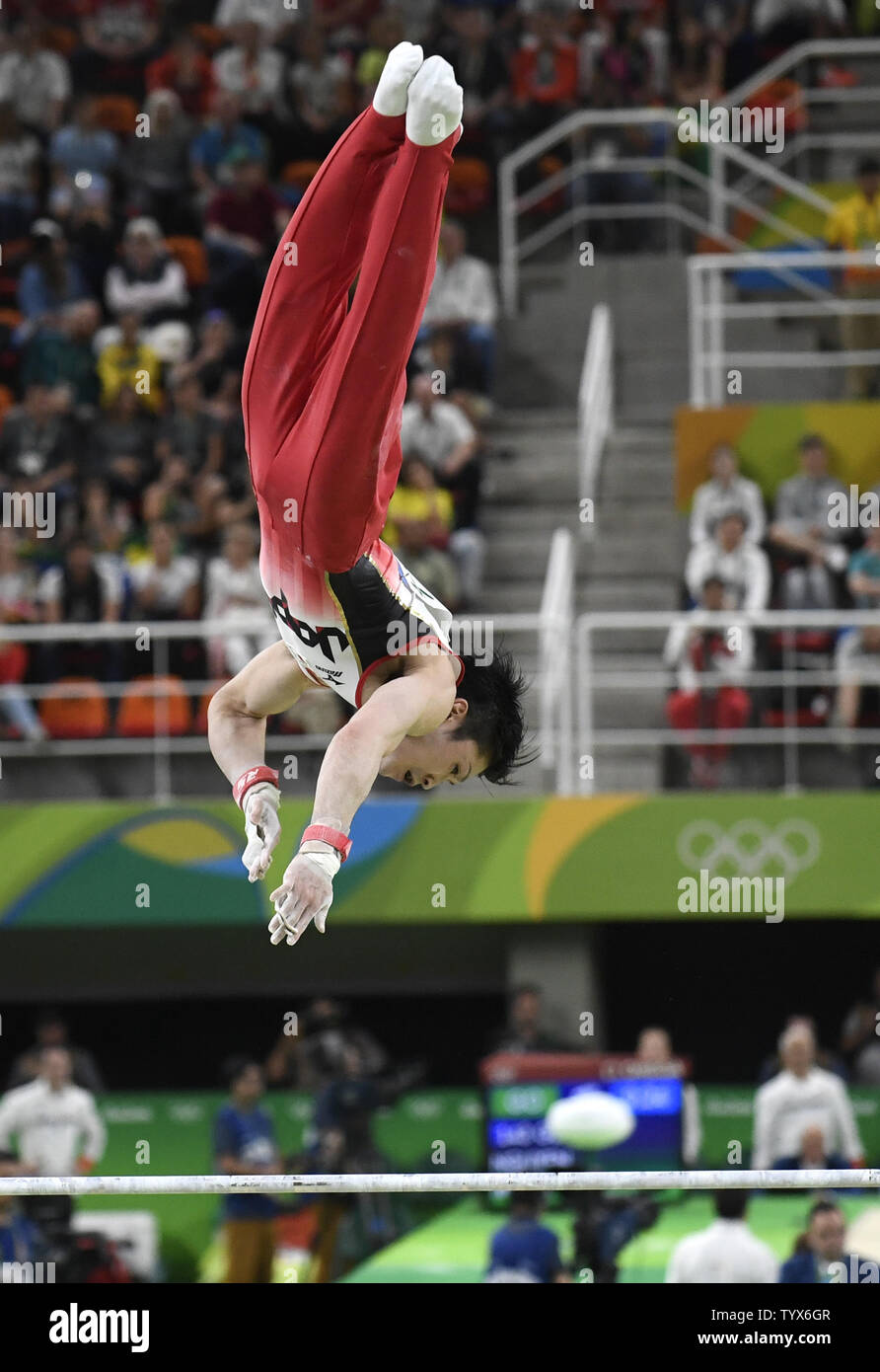 Japanese gymnast Kohei Uchimura is airborne above the Horizontal Bar as ...