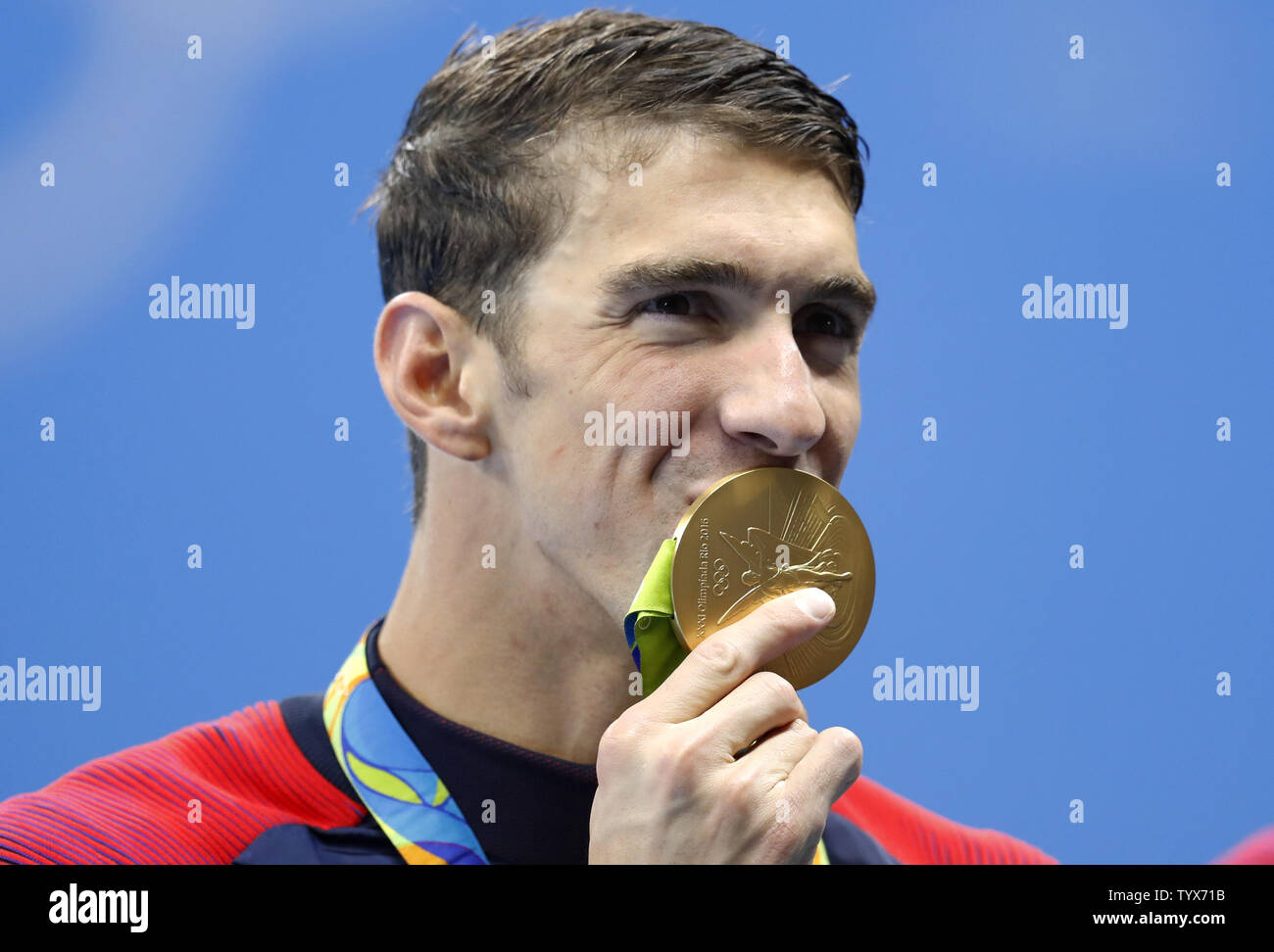 Michael Phelps of the United States celebrates with teammates after ...