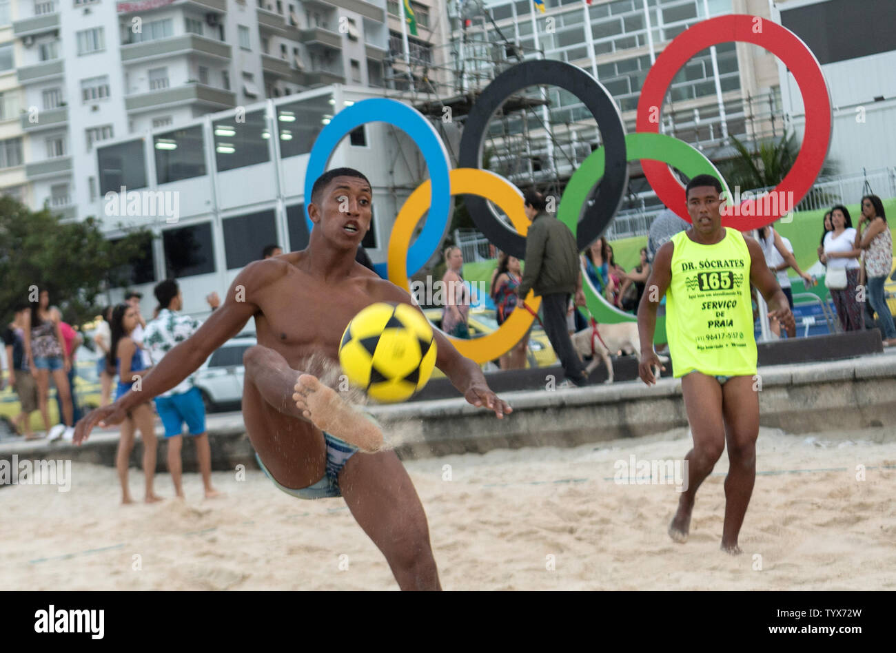 Local residents play soccer volleyball known locally as Footvolley on ...