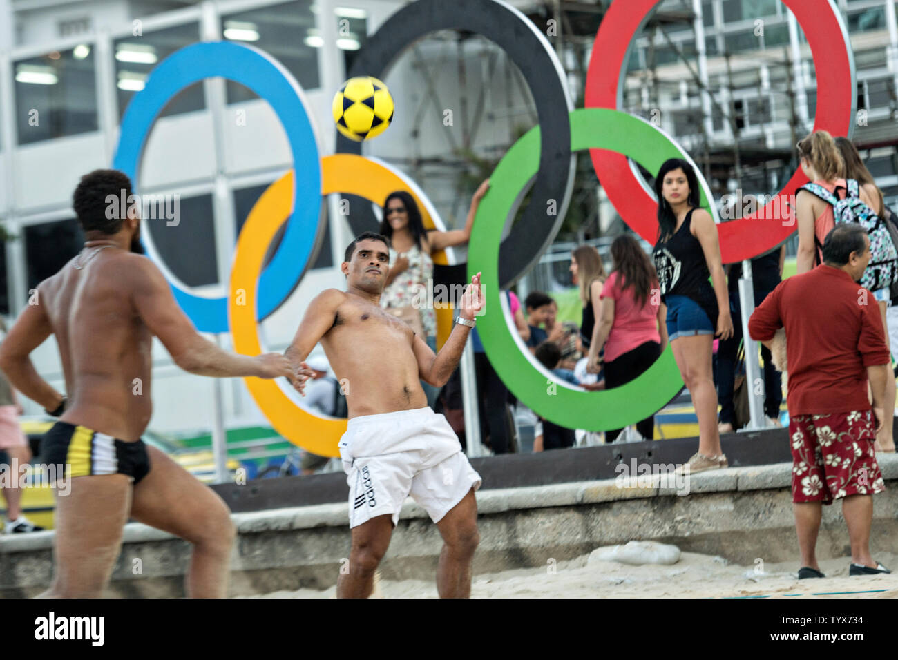Local residents play soccer volleyball known locally as Footvolley on ...