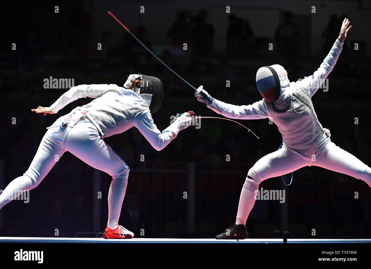 Italian Elisa Di Francisca (L) and Russian Inna Deriglazova compete in ...