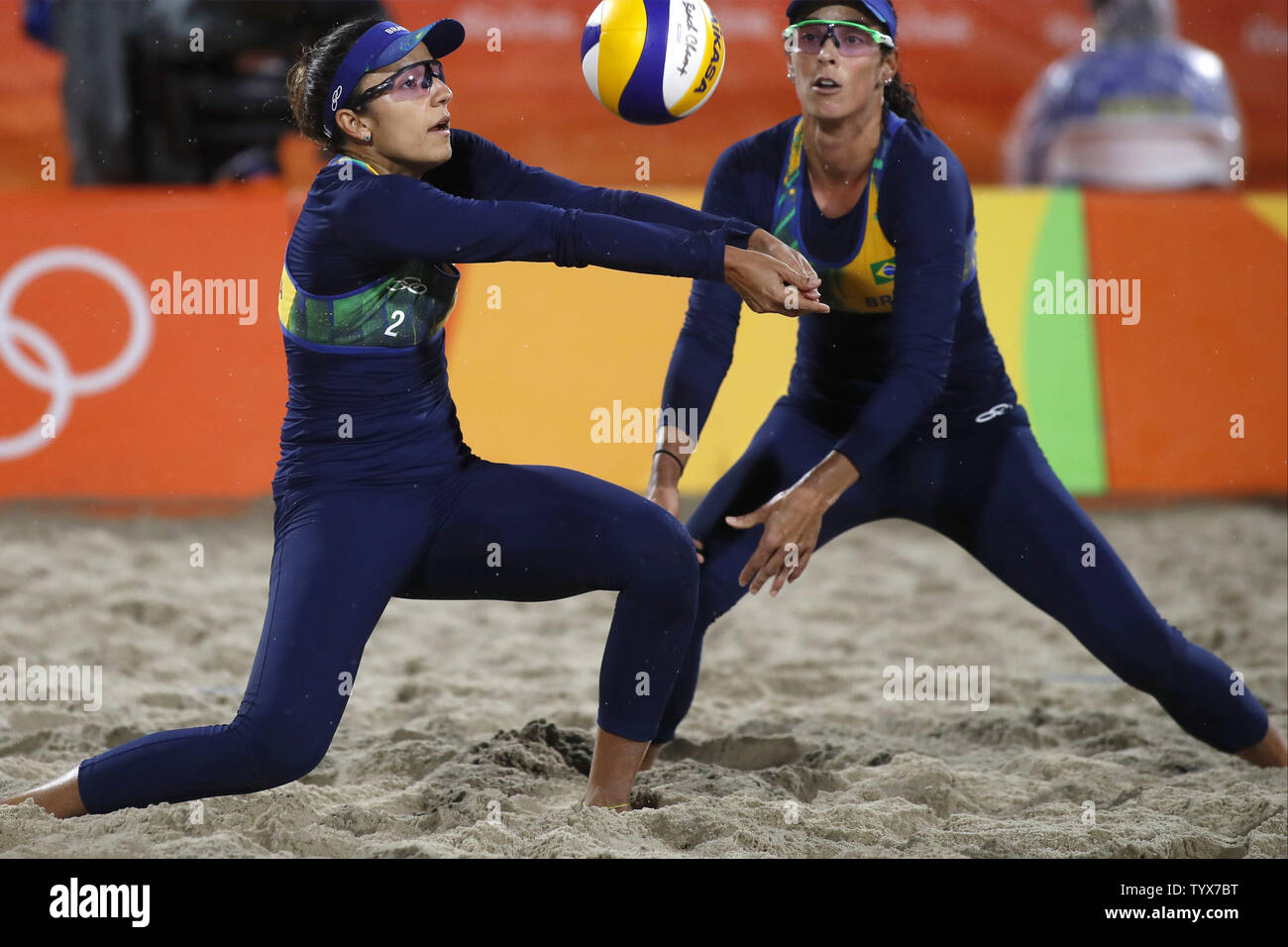 Brazil's during B‡rbara Seixas (2) digs a ball as teammate çgatha ...