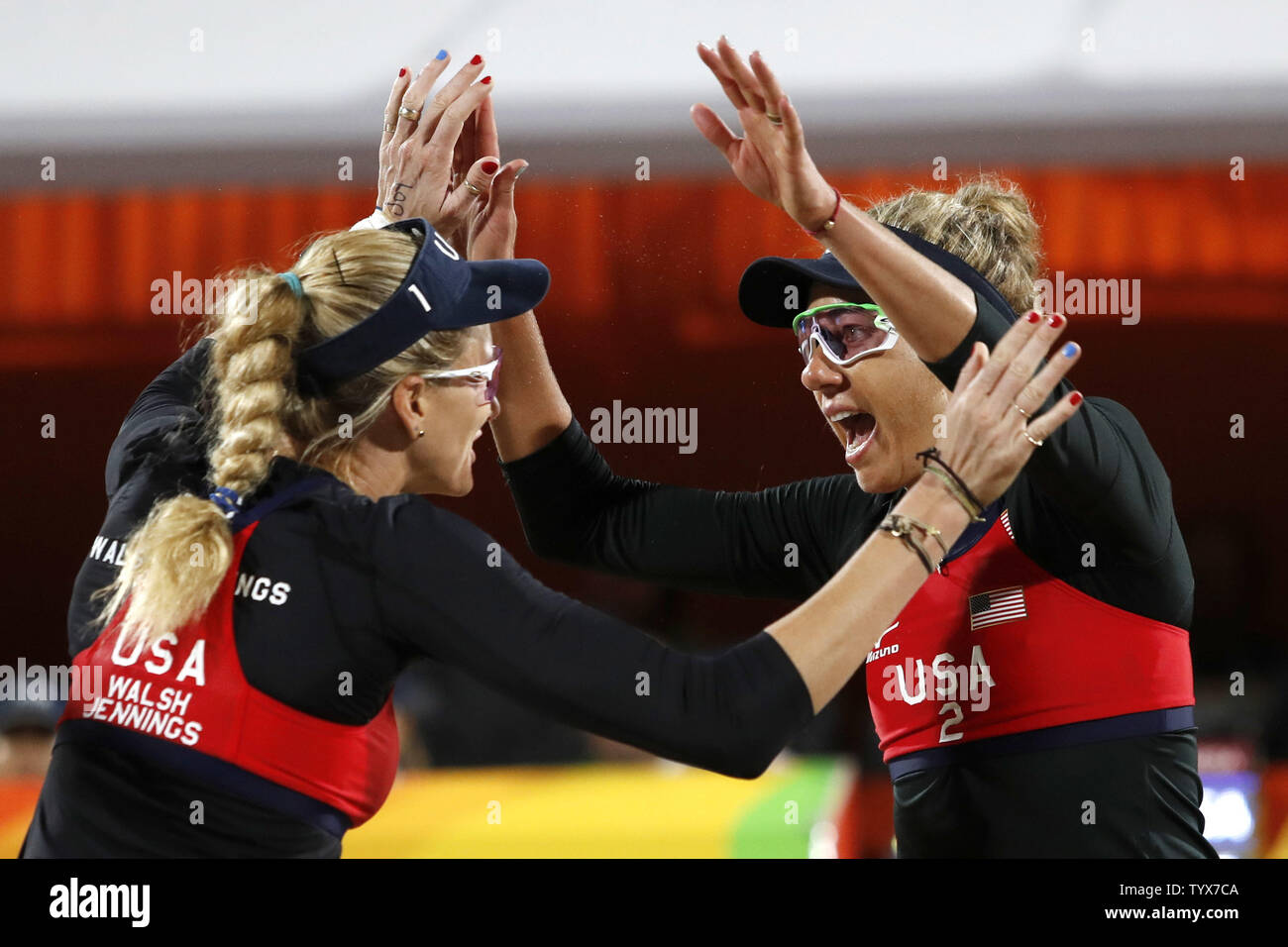 USA's Kerri Walsh Jennings (L) celebrates with teammate Aril Ross ...