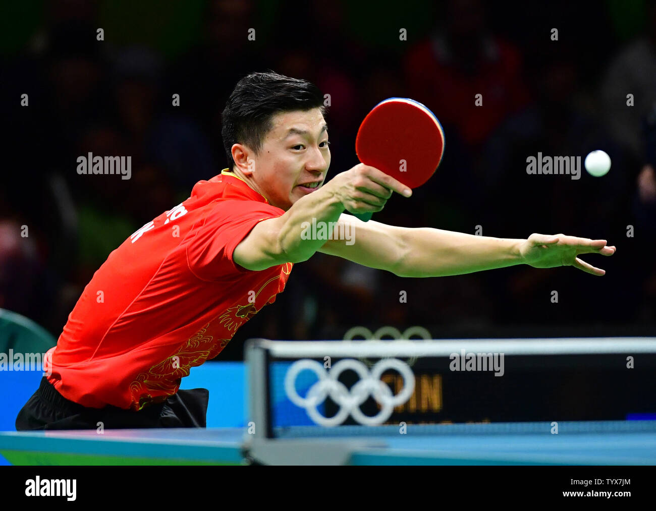 China's Ma Long competes against China's Zhang Jike in the Men's ...