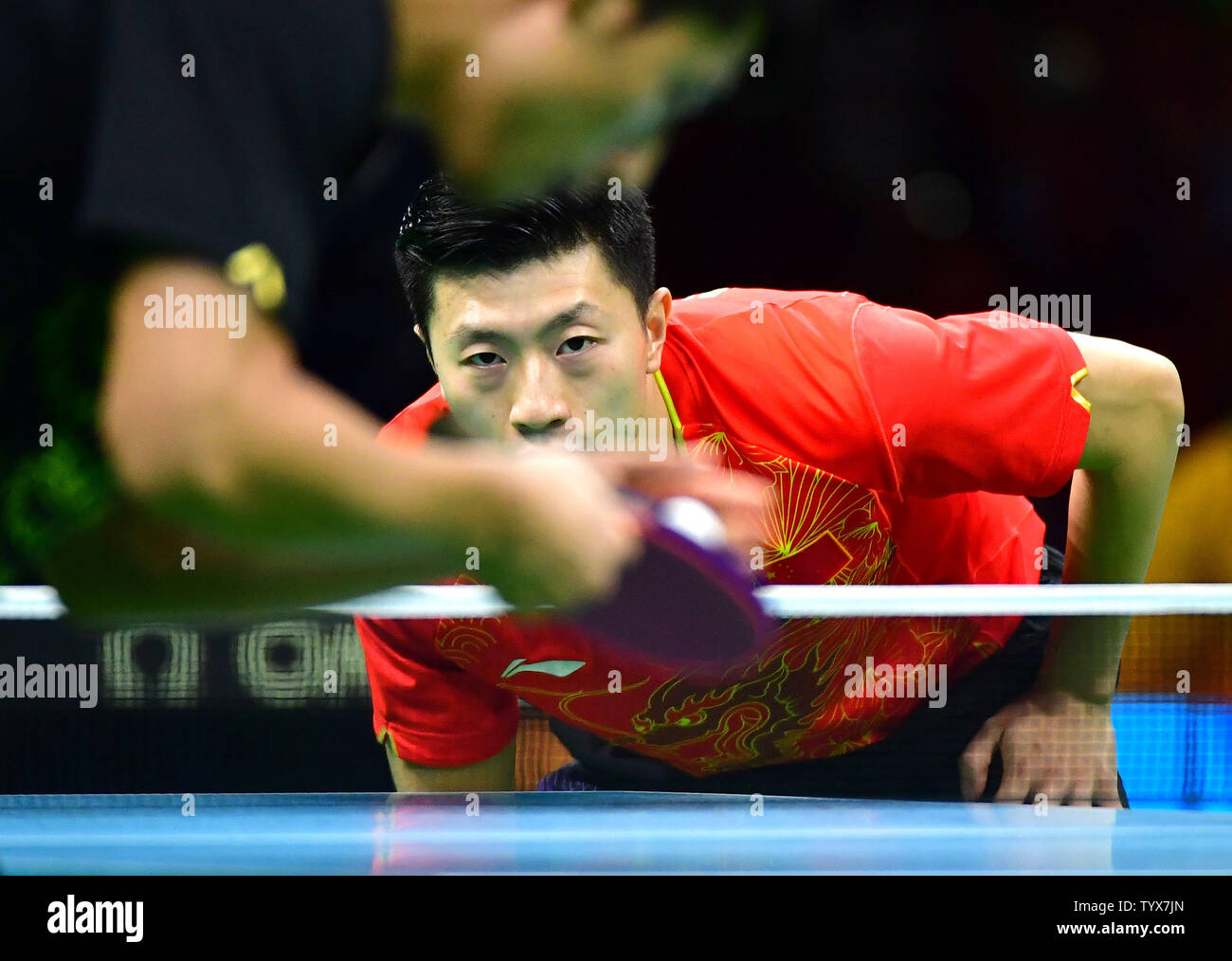China's Ma Long competes against China's Zhang Jike in the Men's ...