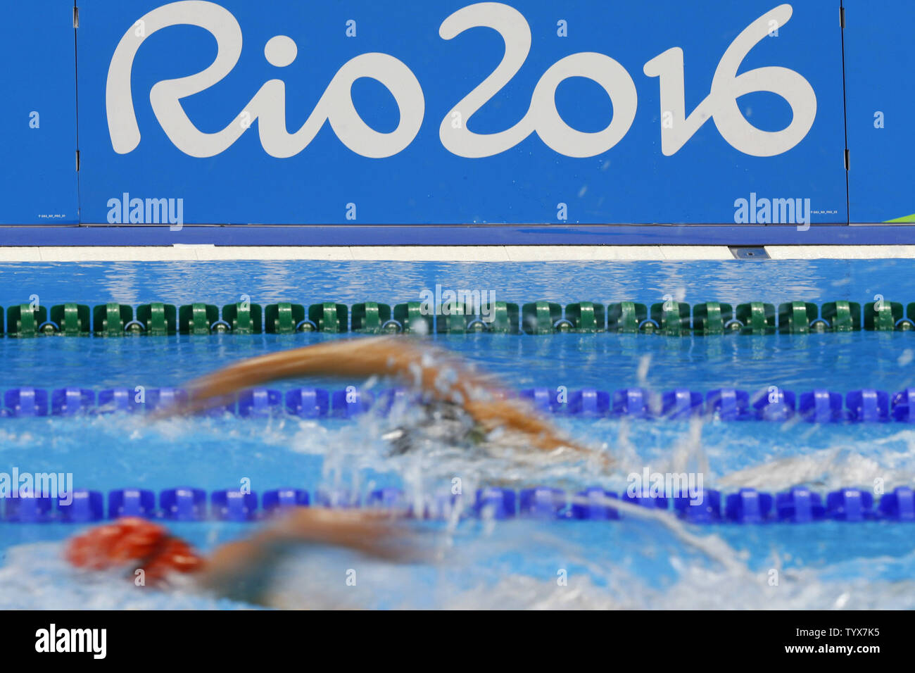 Swimmers take part in the first heat of the Women's 800M Freestyle at ...