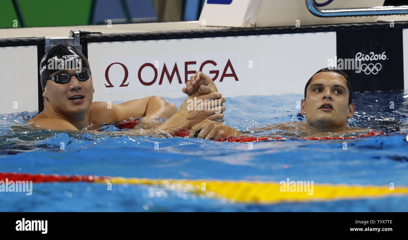 Santo Condorelli of Canada reacts with Nathan Adrian of the United ...