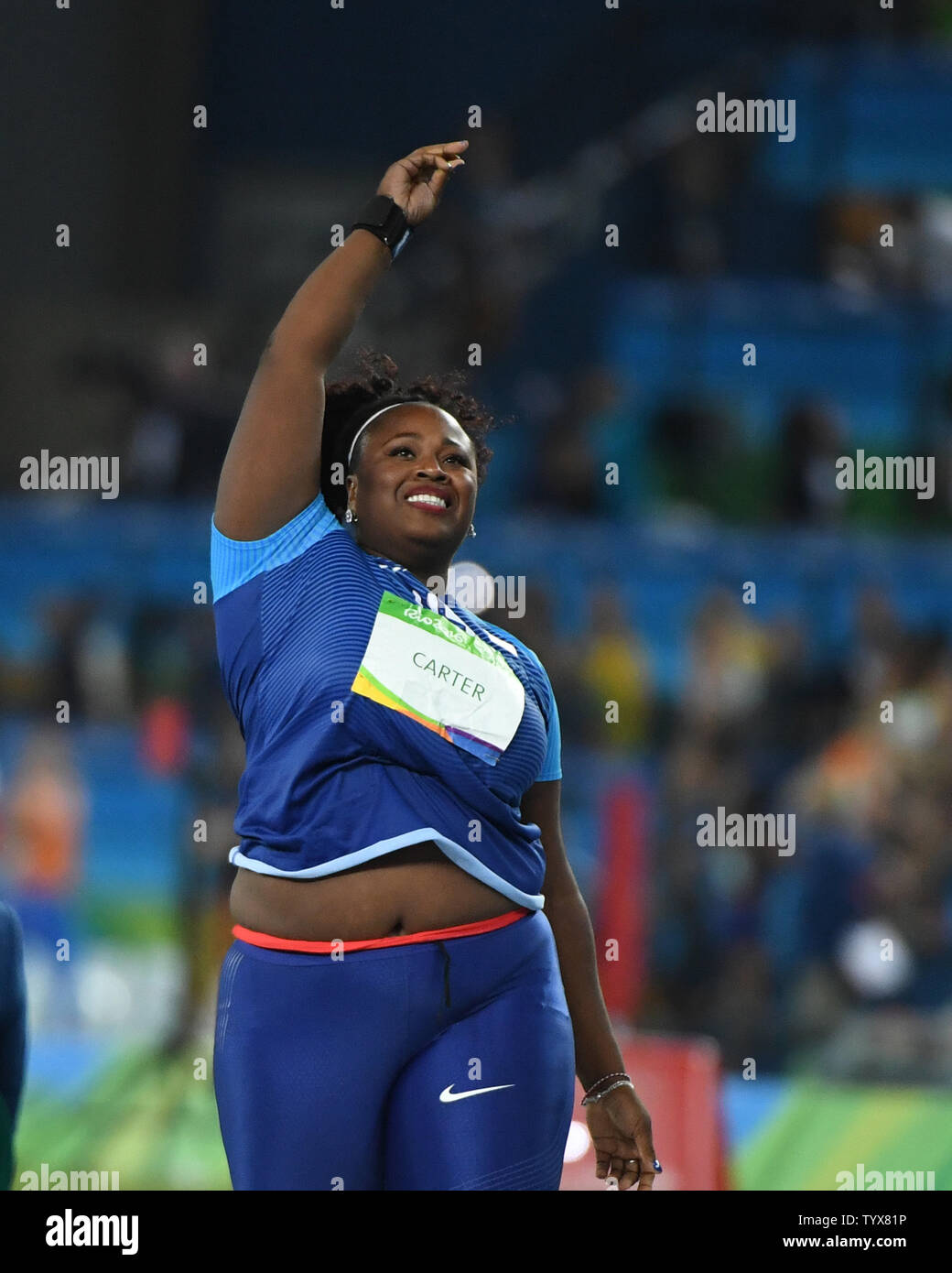 Michelle Carter of the USA watches her throw on the video board in the ...