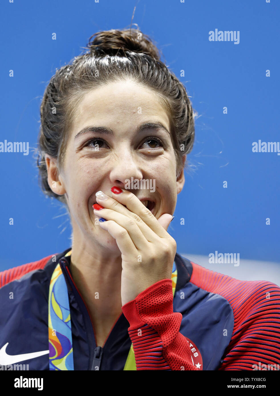 Madeline Dirado (USA) reacts after receiving her gold medal in the ...