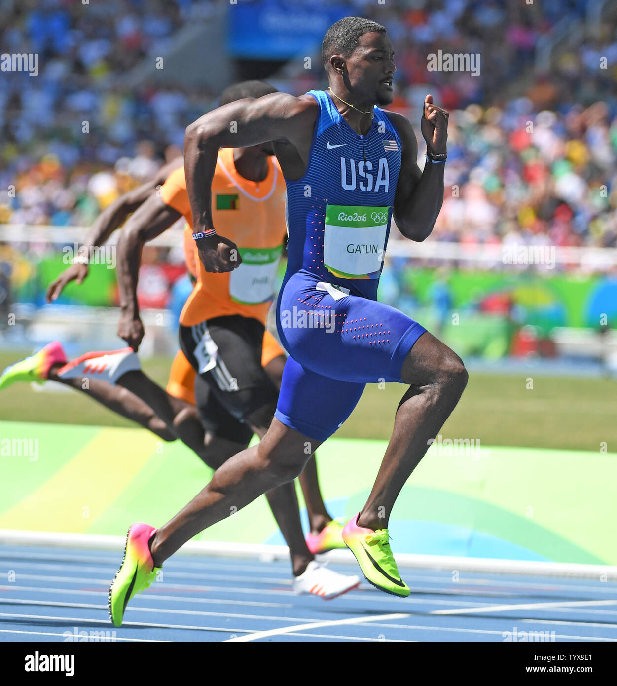 USA's Justin Gatlin runs in his heat of the 100m in the Olympic Stadium ...