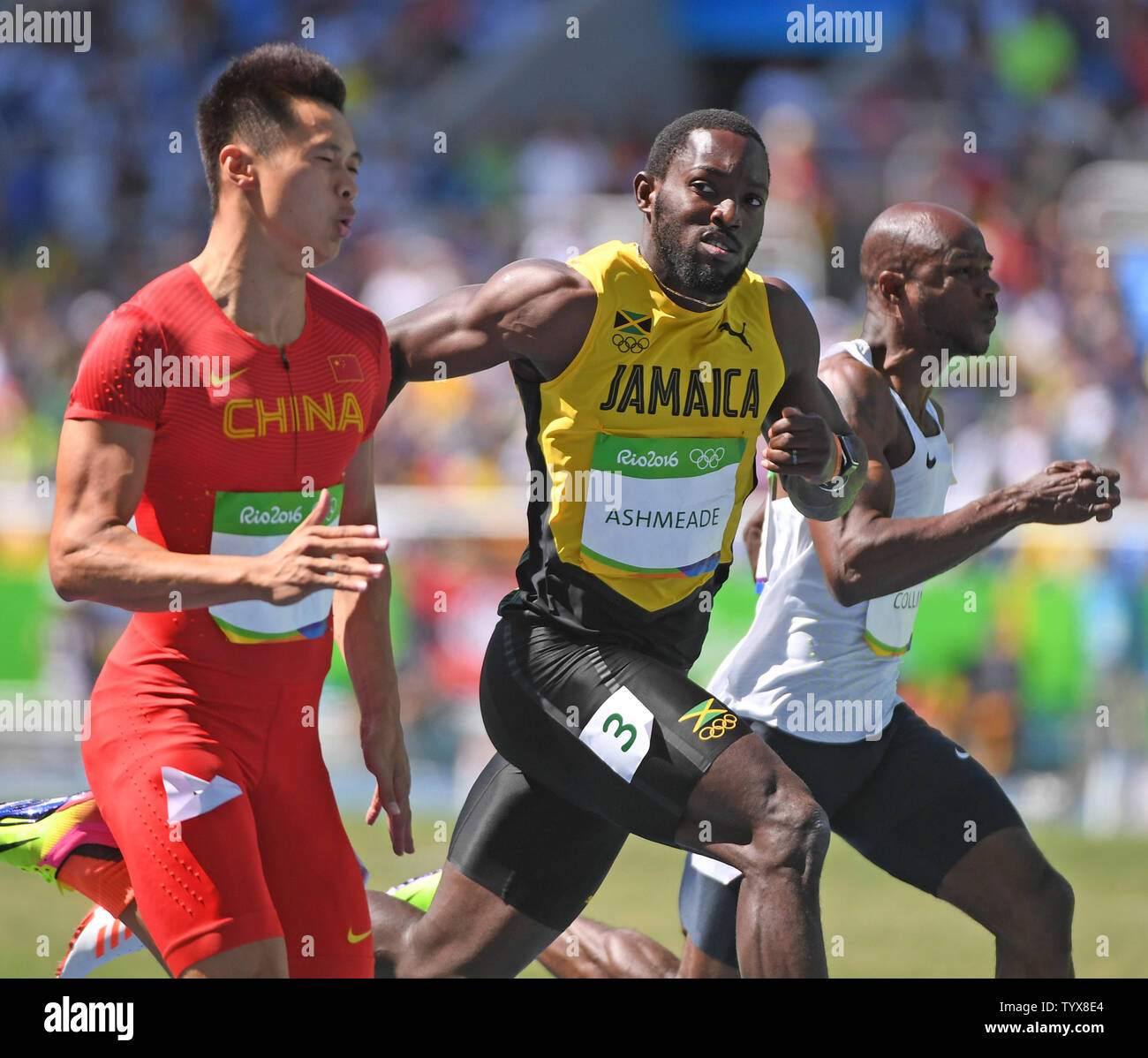 Nickel Ashmeade of Jamaica (C) looks over as Shenye Xie of China (L ...