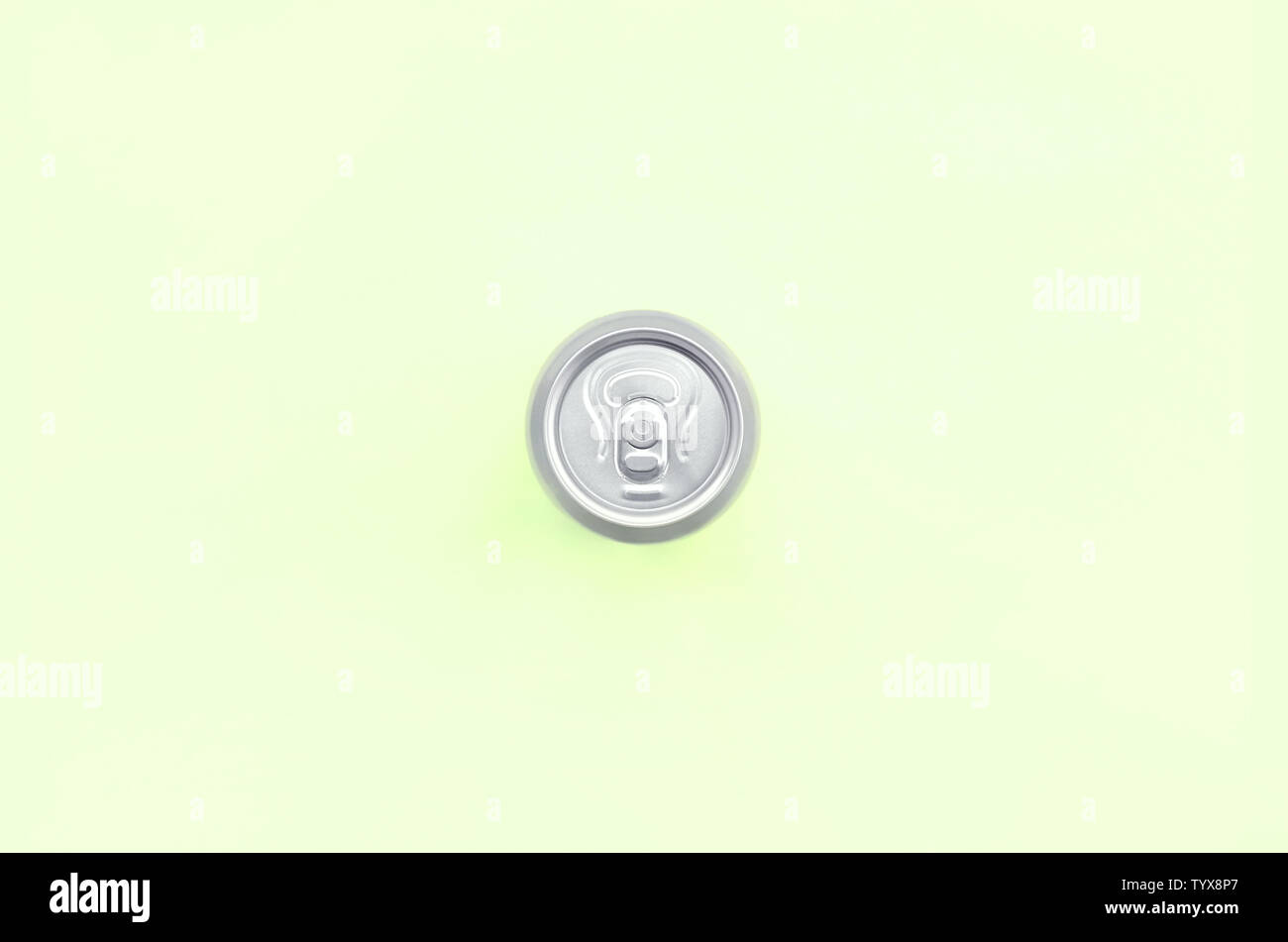 Metallic beer can on texture background of fashion pastel lime color ...