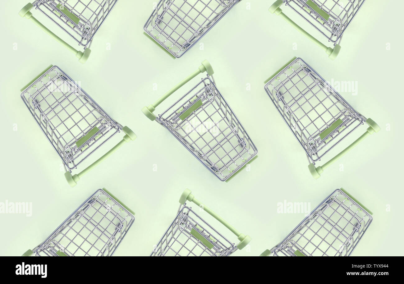 Pattern of many small shopping carts on a lime background. Minimalism ...
