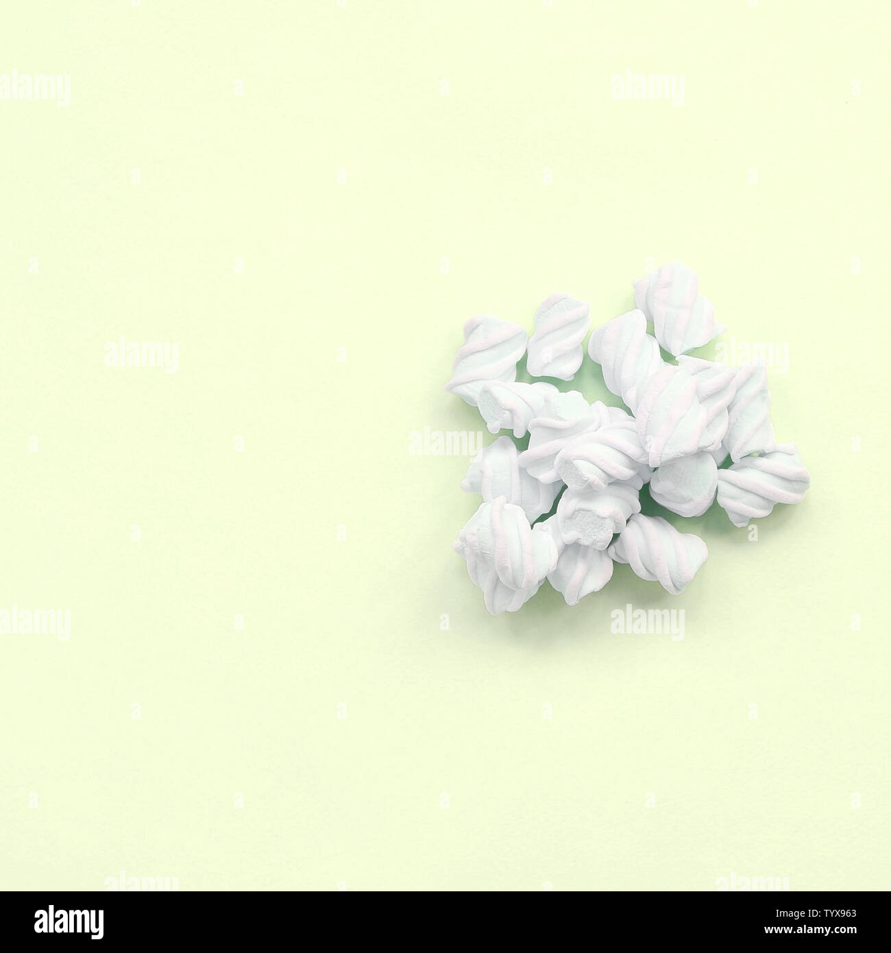 Colorful marshmallow laid out on lime paper background. pastel creative ...