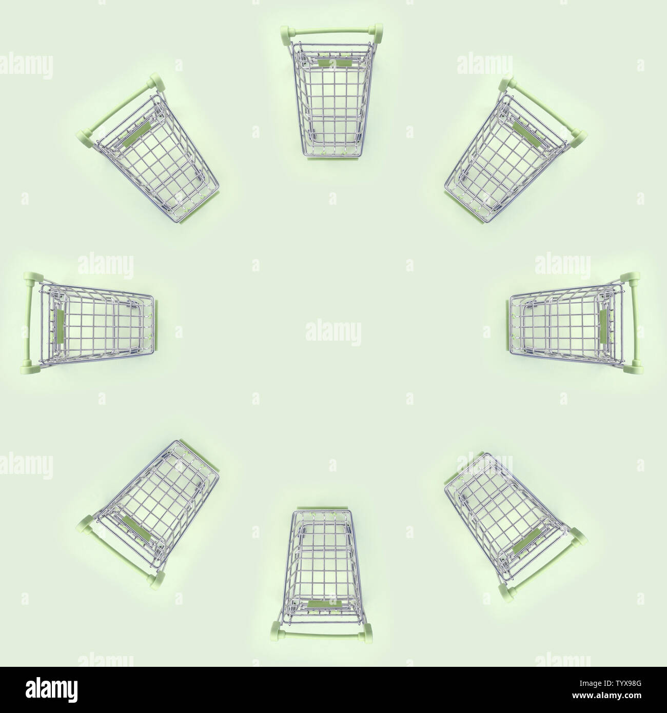 Pattern of many small shopping carts on a lime background. Minimalism ...