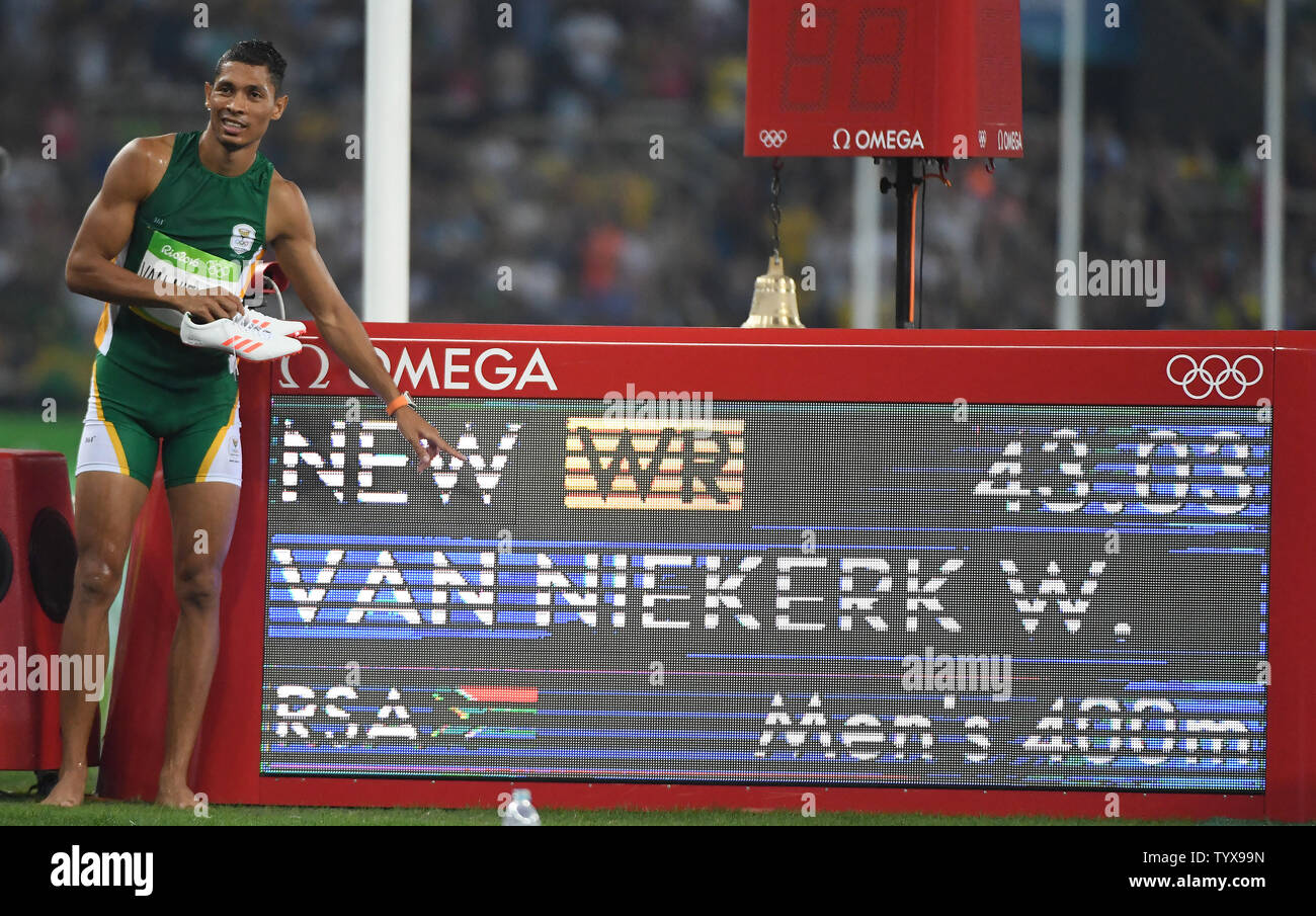 Gold medalist Wayde Van Niekerk (RSA) points to his world record time ...