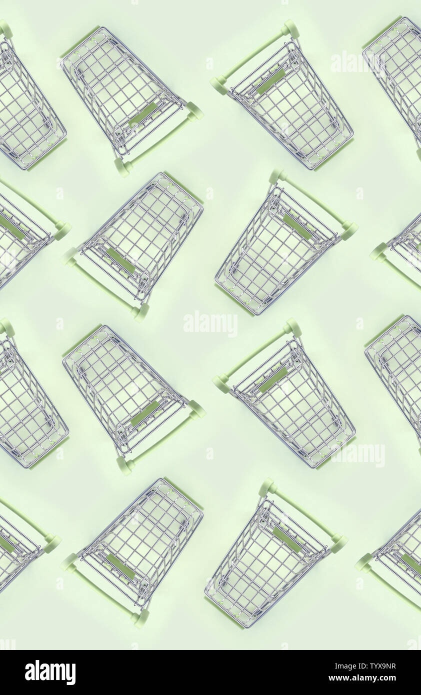 Pattern of many small shopping carts on a lime background. Minimalism ...