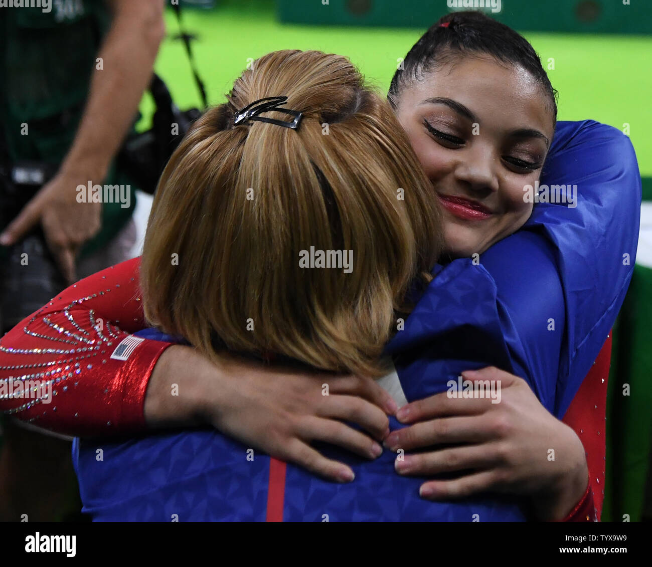Silver medalist Laurie Hernandez (R) of the USA hugs a teammate after ...
