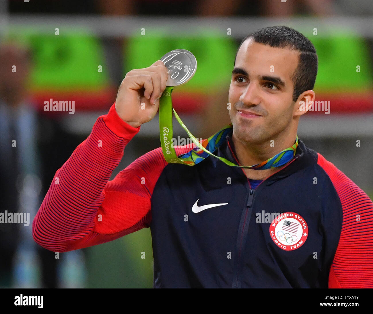 Danell Leyva of the United States holds his gold medal after competing ...
