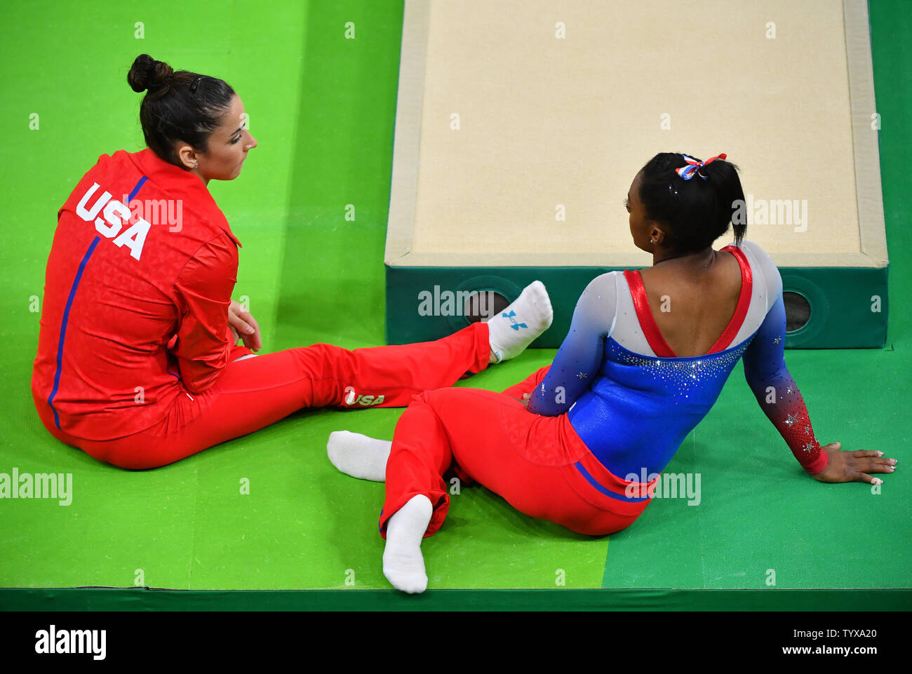 Aly Raisman and Simone Biles wait for their turn on floor routine at ...