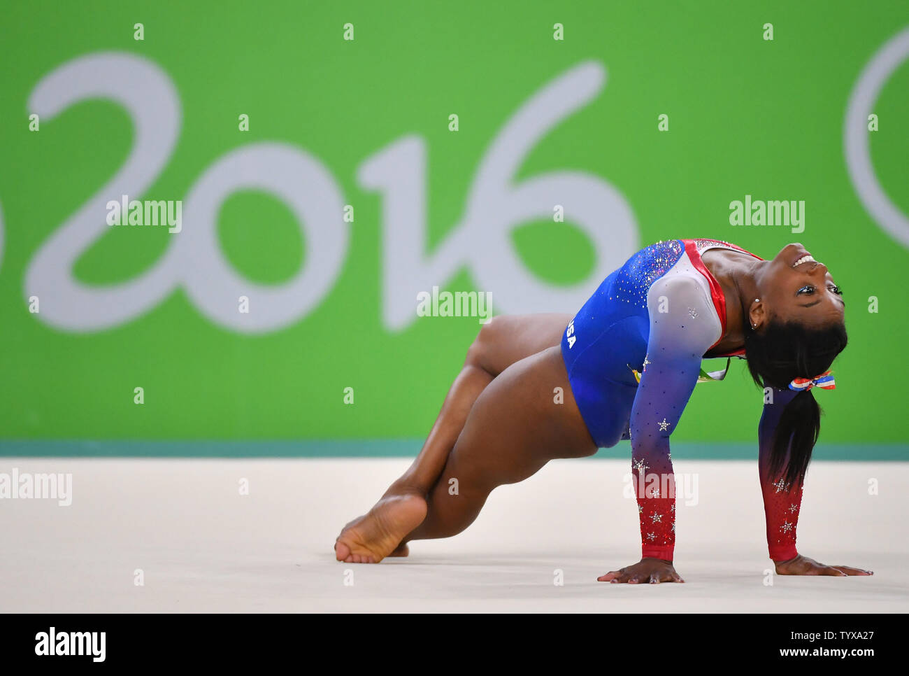 Simone Biles of the United States competes and wins the gold medal in ...