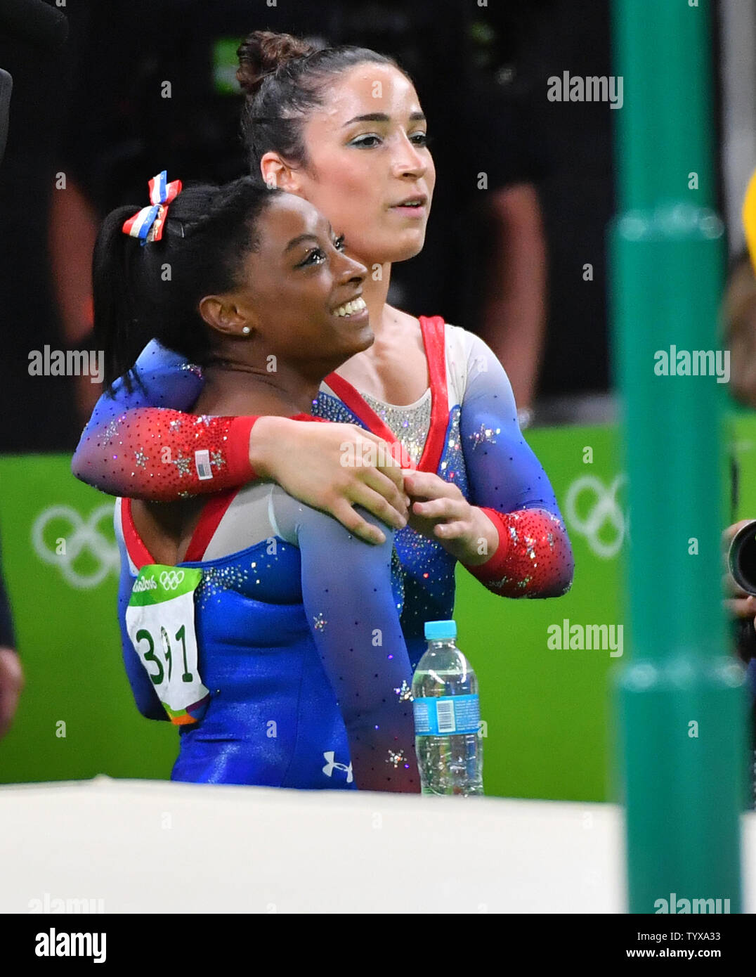 Aly Raisman and Simone Biles of the United States embrace after they ...
