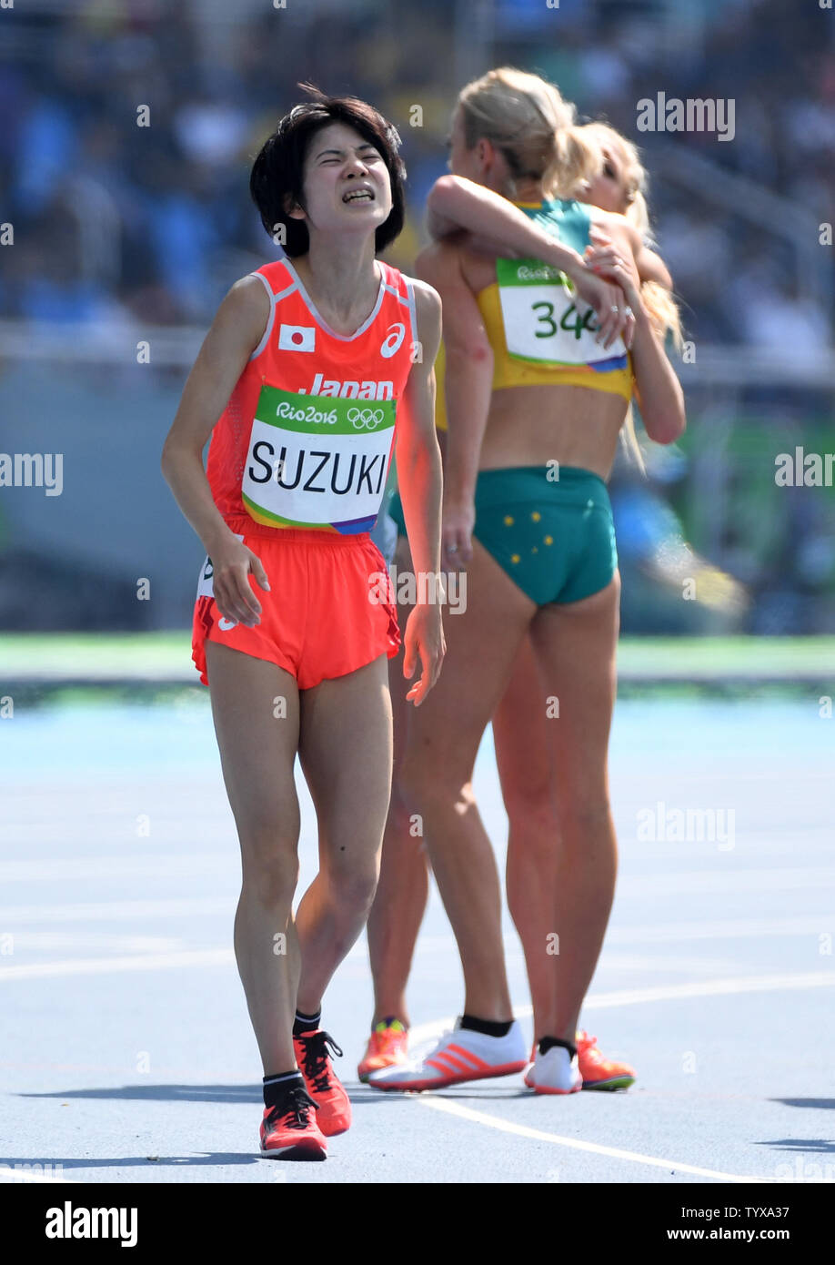 Japan's Ayuko Suzuki winces after finishing the Women's 5000m heat 2 at ...