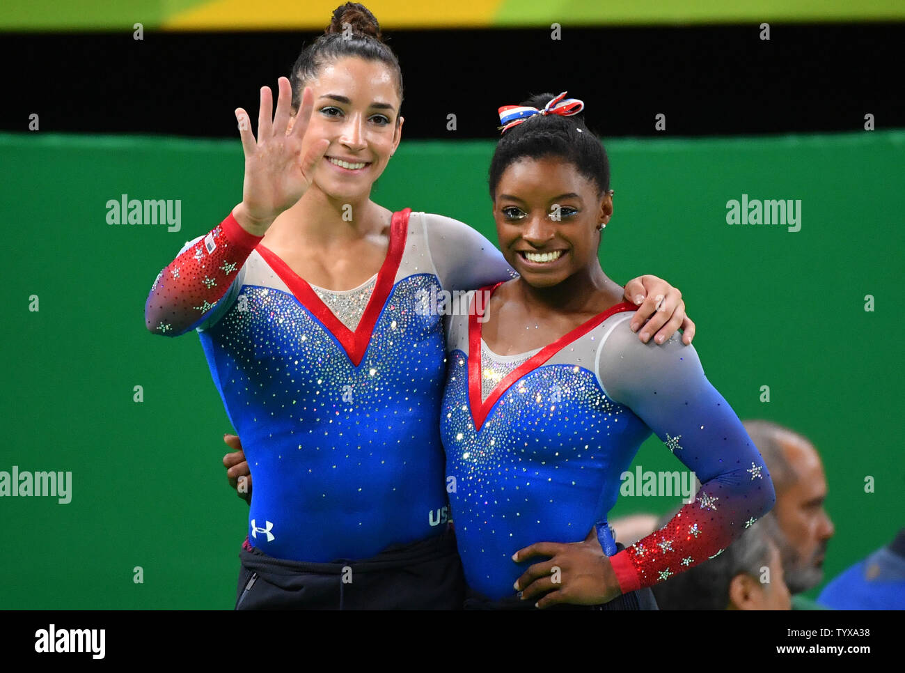 Aly Raisman and Simone Biles of the United States smile after they win ...