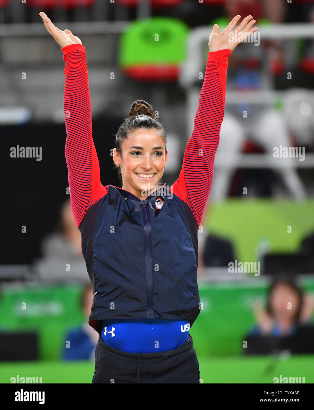 Aly Raisman of the United States raises her hands in the air after ...