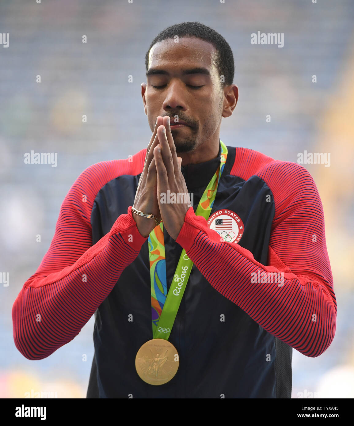 USA's Christian Taylor takes a moment after being awarded the gold ...