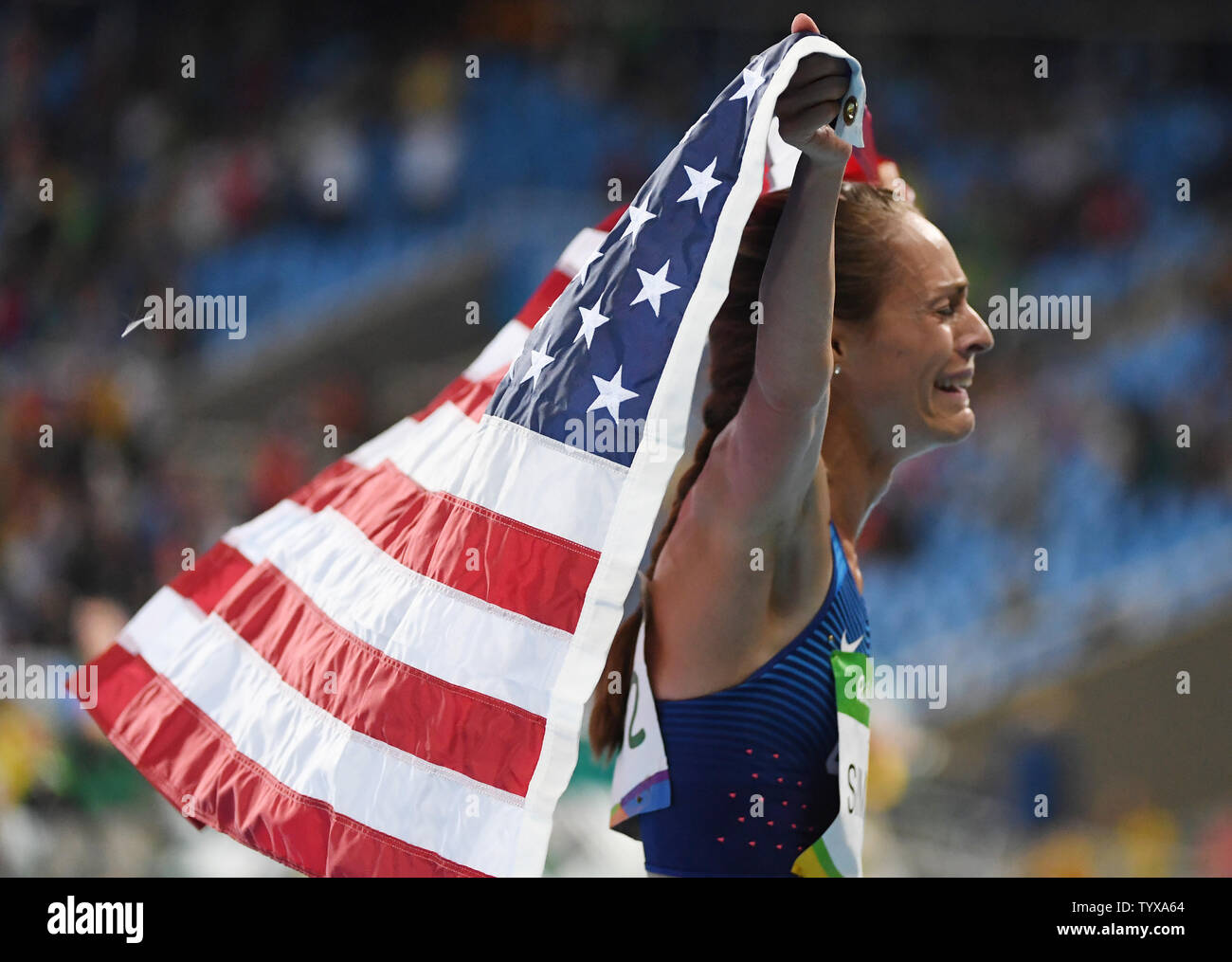 Jennifer Simpson of the United States celebrates with the American flag ...