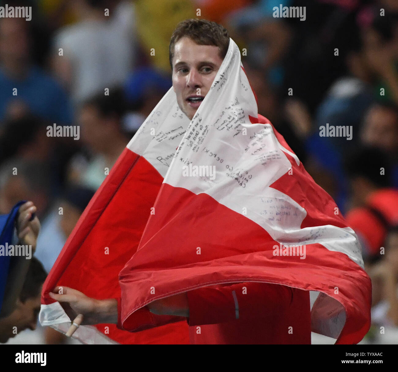 Derek Drouin of Canada wraps himself in the flag after winning gold in ...